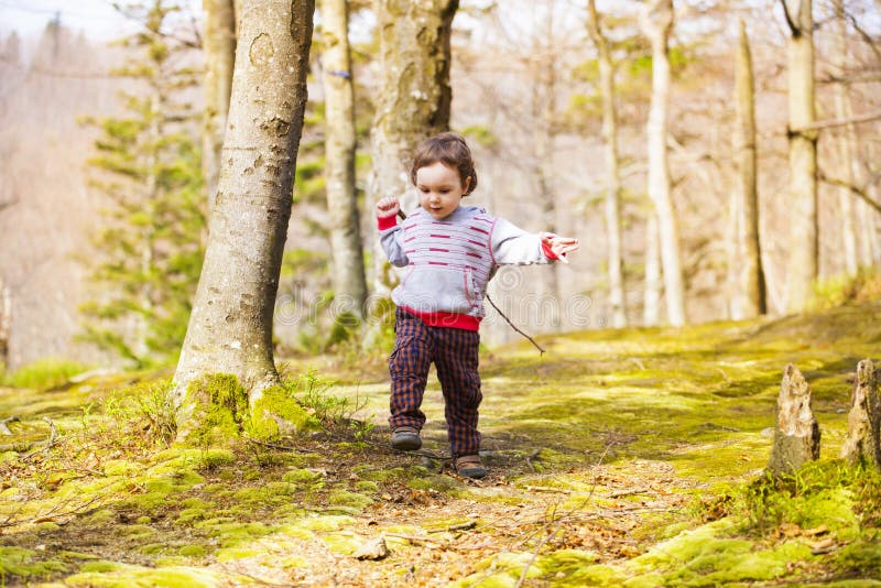 A Little Boy Playing in the Woods. Stock Photo - Image of nature ...