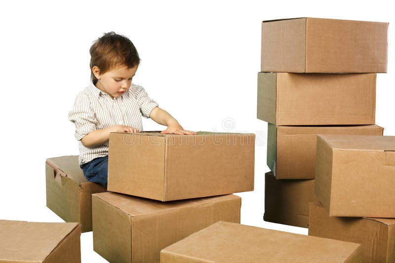 Little boy plays in boxes stock image. Image of child - 39666505