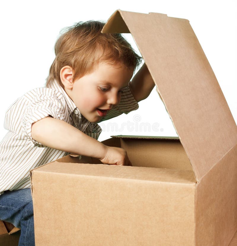 Child in box stock image. Image of cabin, face, hole, brown - 4021545