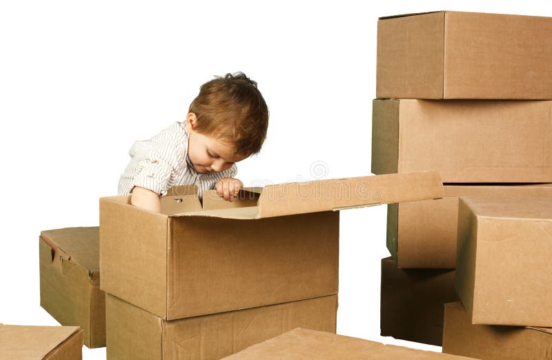Little boy plays in boxes stock image. Image of child - 39666505