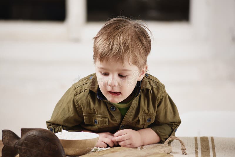 Little Boy Plays at a Table Stock Image - Image of smile, hungry: 62705699