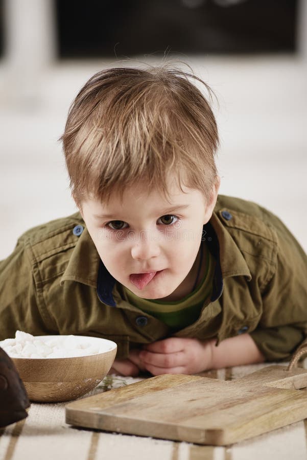 Little Boy Plays at a Table Stock Image - Image of seat, youth: 62705819