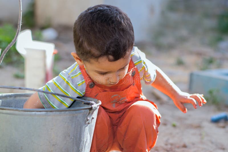 Little Boy Plays with Water Stock Photo - Image of summer, caucasian ...