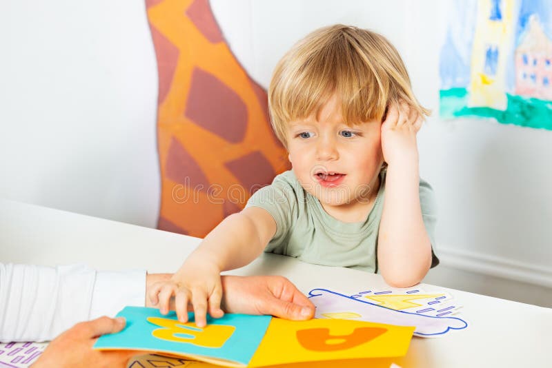 Little Boy Point To Letters on the Page in a Book Stock Image - Image ...
