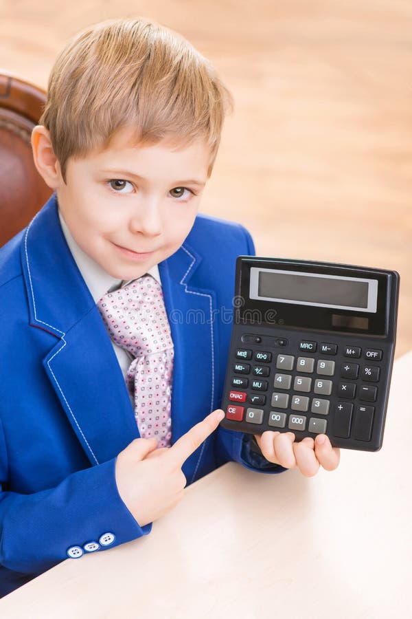 Little Boy Pointing at the Calculator Stock Photo - Image of youth ...