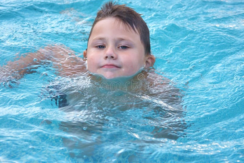 A little boy in a pool stock photo. Image of plays, smile - 15629620