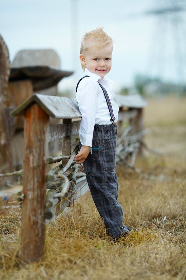 Boy hitch hiking at road stock photo. Image of little - 35007096
