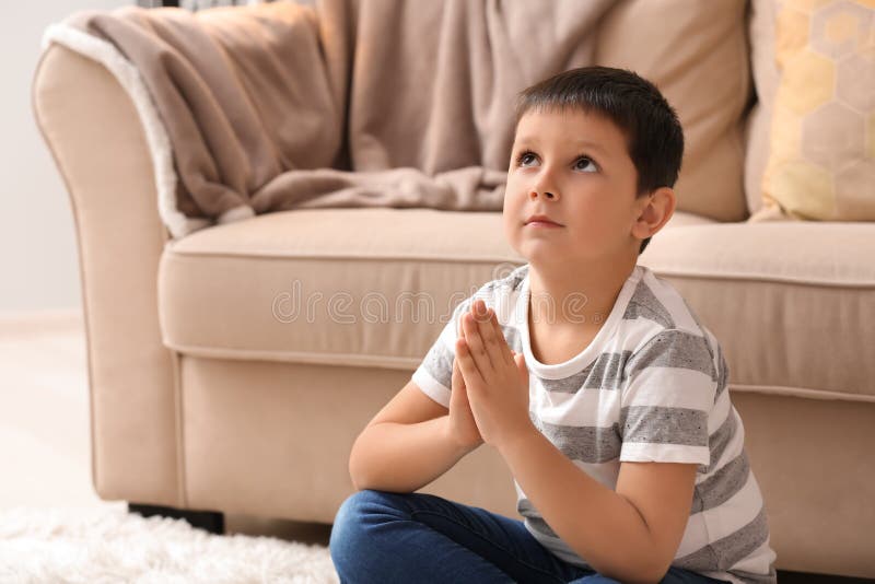 Little boy praying at home stock photo. Image of intercede - 151275654