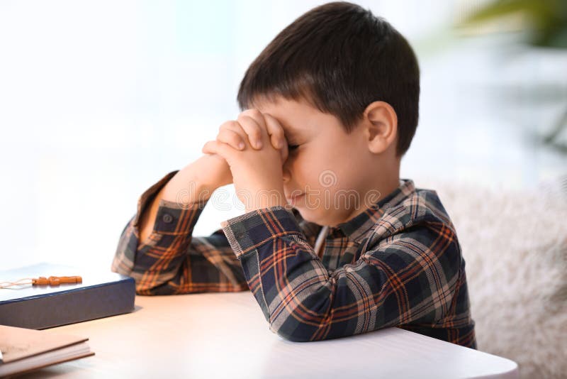 Little boy praying at home stock photo. Image of people - 151275970