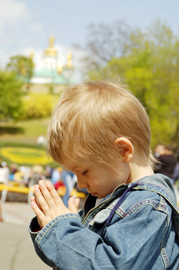 Little boy praying outside stock image. Image of jesus - 19439867