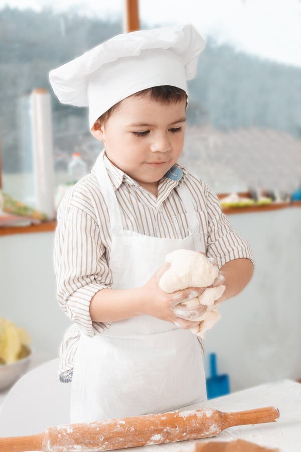 Little boy preparing dough stock image. Image of cooking - 31495155