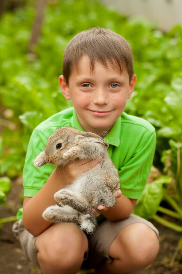 The Little Boy with a Rabbit in the Hands Stock Image - Image of color ...