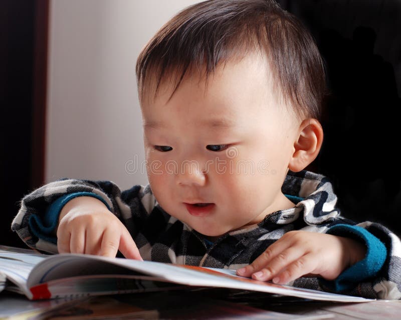 Little boy reading book stock photo. Image of knowledge - 20641282
