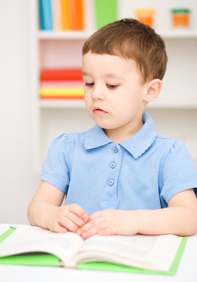 Little Boy is Reading a Book Stock Image - Image of adorable, smiling ...