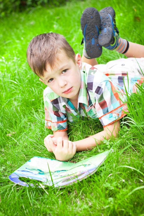 Little boy reading book stock image. Image of reading - 58628611