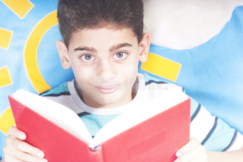 Boy reading at home stock image. Image of read, happy - 132067375