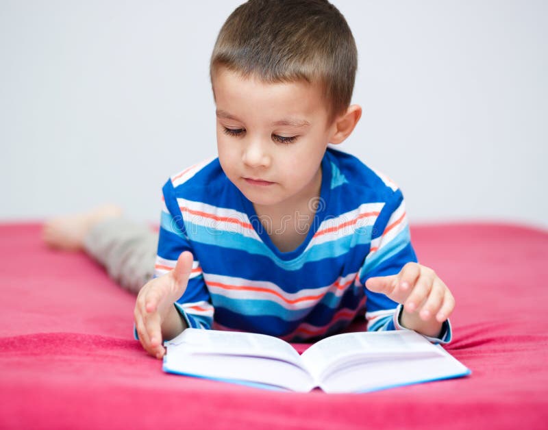 Little Boy is Reading a Book Stock Photo - Image of school ... Little Boy is Reading a Book Stock Photo - Image of school ...