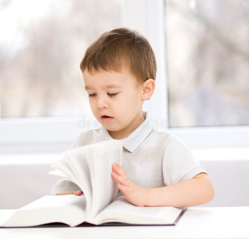 Little Boy is Reading a Book Stock Photo - Image of people, learning ...