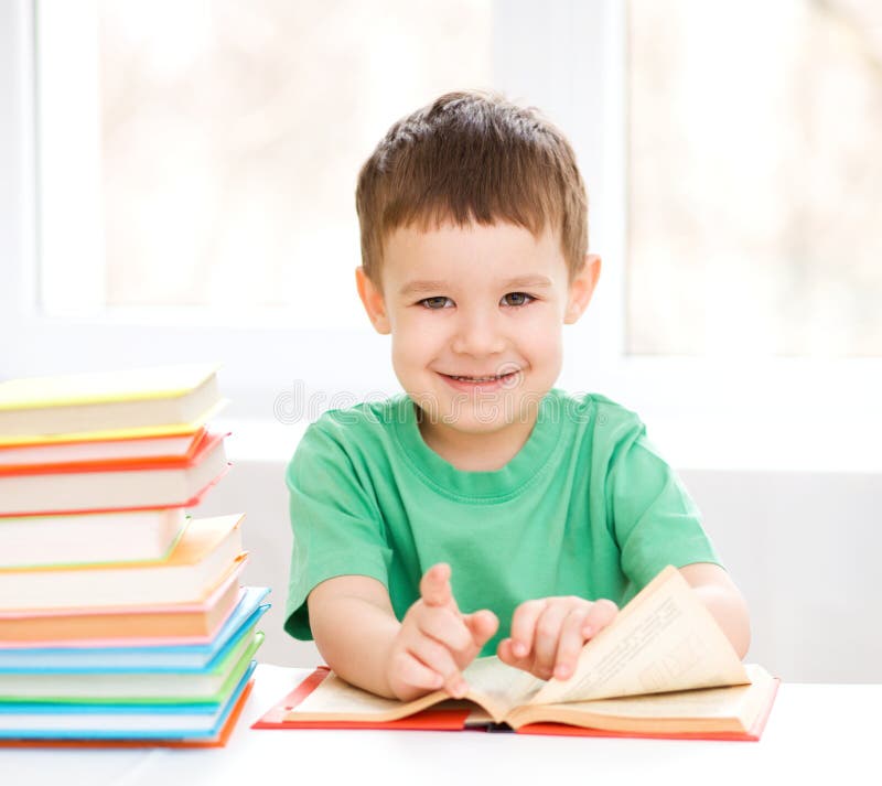 Little Boy is Reading a Book Stock Photo - Image of school, smiling ...