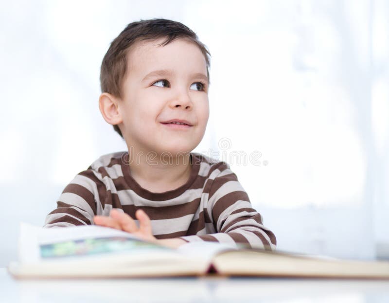 Little Boy is Reading a Book Stock Image - Image of portrait, sitting ...