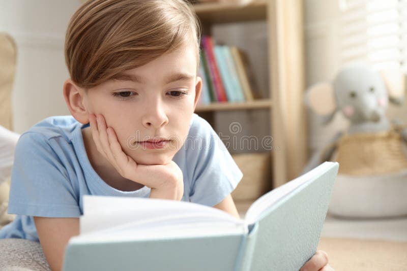 Little Boy Reading Book on Floor Stock Image - Image of literary, paper ...