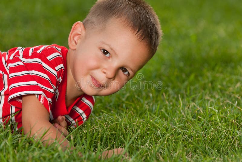 Little Boy in Red on the Green Grass Stock Photo - Image of summer ...