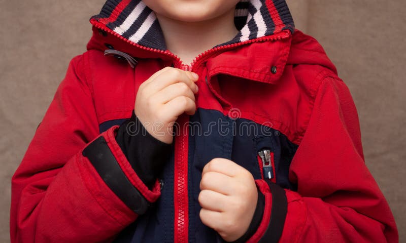 Little boy in a red jacket stock image. Image of lifestyle - 214489401