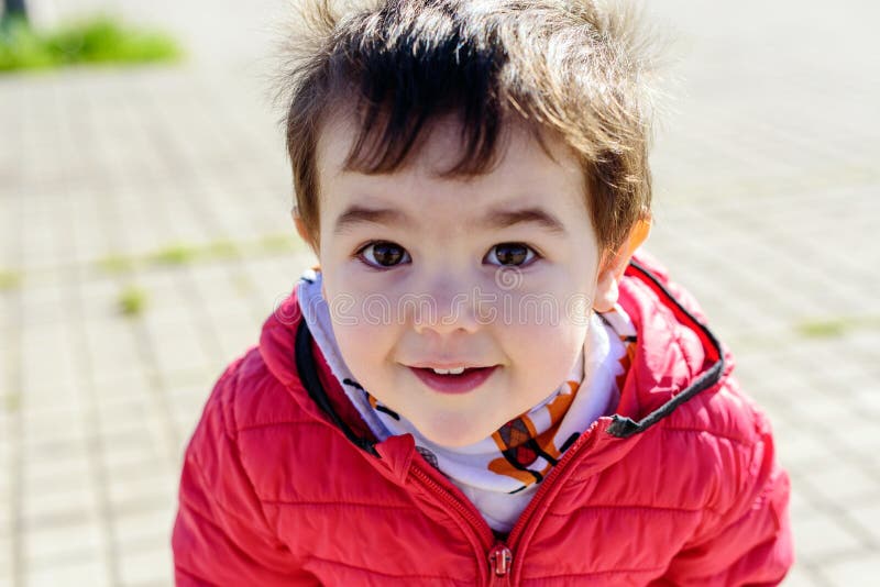 Little boy with red jacket stock image. Image of outdoor - 166377981
