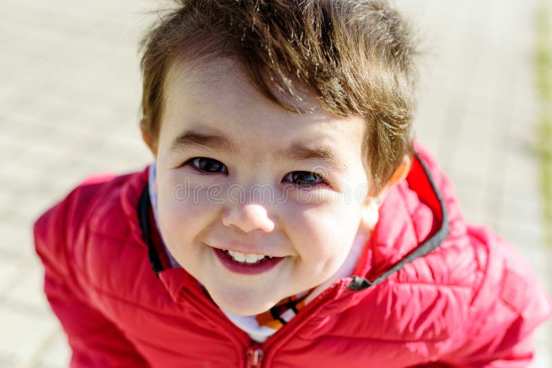 Little boy with red jacket stock photo. Image of cute - 166378066