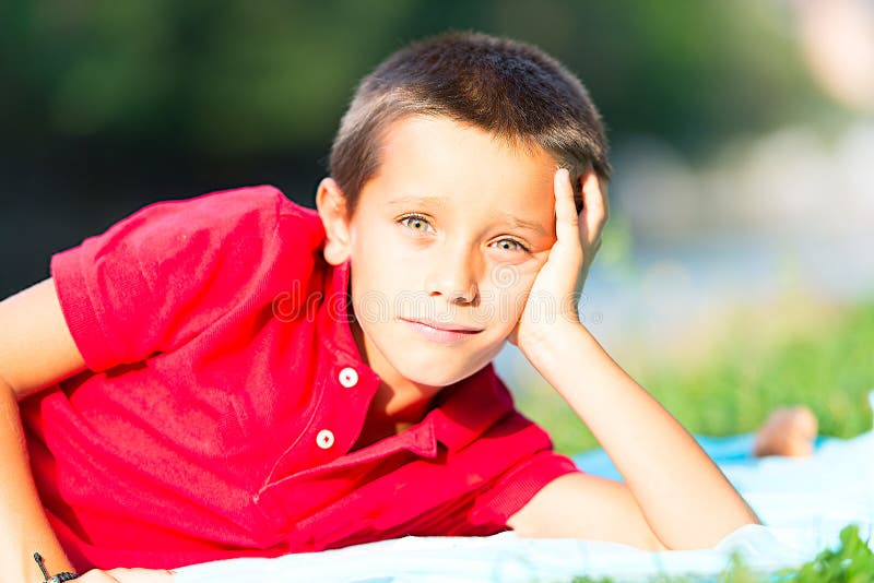 Little Boy with a Red Mesh Sitting in the Meadow Stock Image - Image of ...