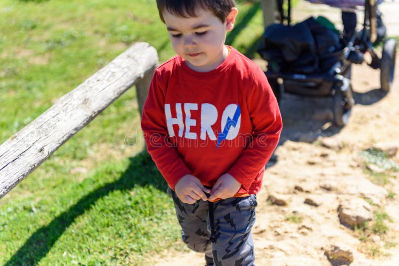 Little Boy with Red Shirt in Green Meadow Stock Image - Image of grass ... Little Boy with Red Shirt in Green Meadow Stock Image - Image of grass ...