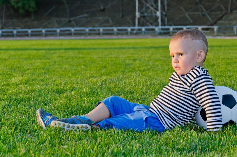 Little Boy Relaxing with His Soccer Stock Photo - Image of child, tired ...