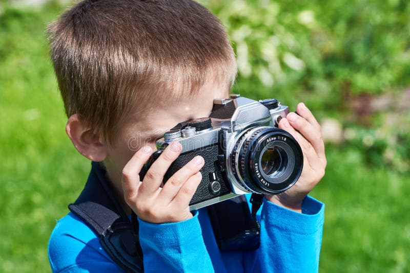 Little Boy with Retro SLR Camera Shooting Stock Photo - Image of lens ...
