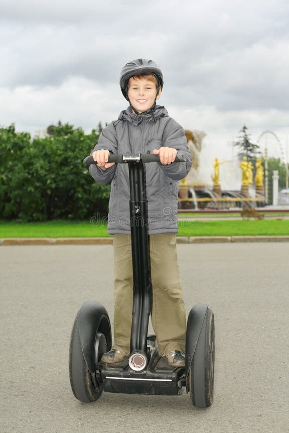 Little boy ride on segway stock image. Image of active - 28023319