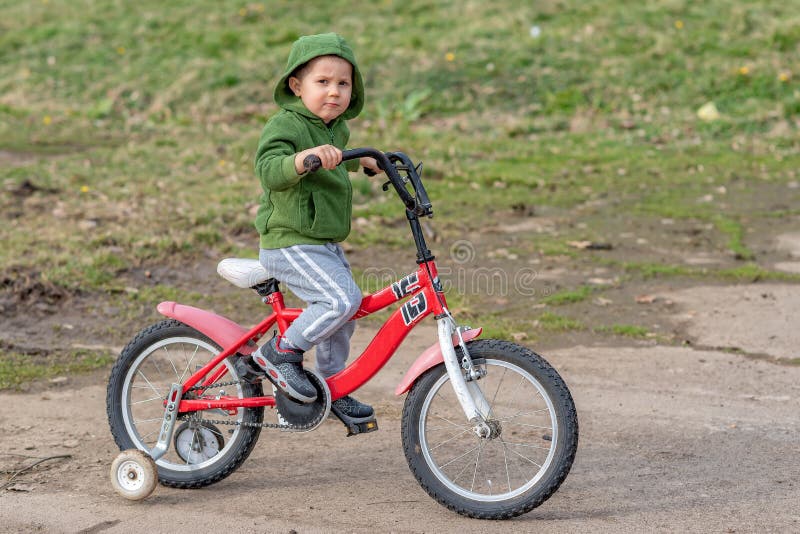 The Little Boy Rides a Bicycle Stock Photo - Image of exercise, leisure ...