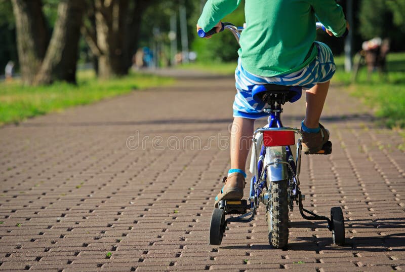 Little Boy Riding Bike in the Park Stock Image - Image of moving ...