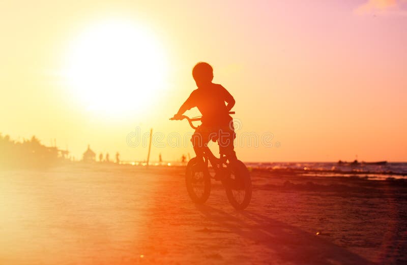 Little Boy Riding Bike at Sunset Stock Image - Image of young, summer ...