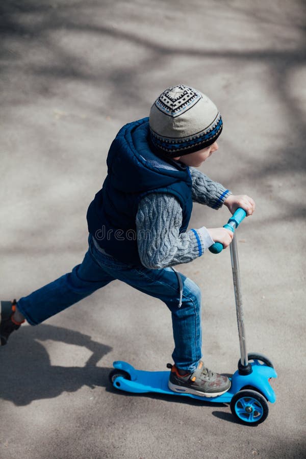 Little Boy Riding Scooter Game Street Spring Stock Photo - Image of ...