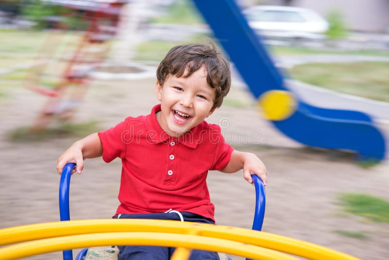 Little boy riding a swing stock photo. Image of summer - 187323308
