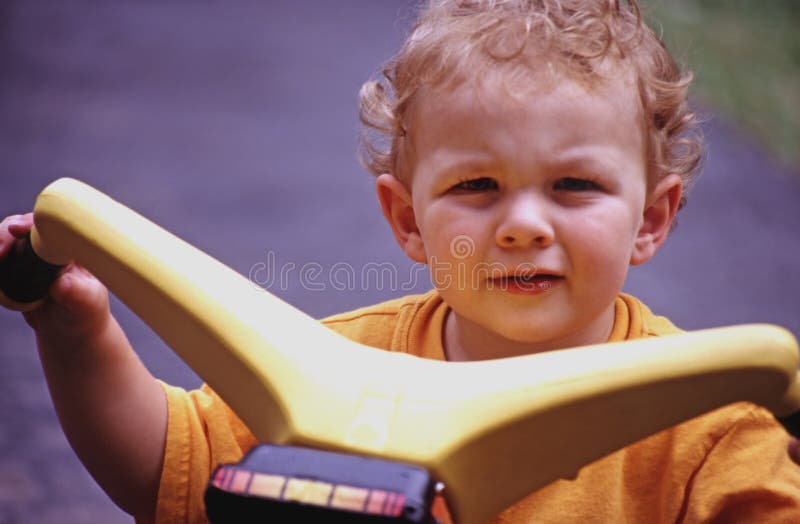 Little boy on riding toy stock image. Image of seasons - 13390873