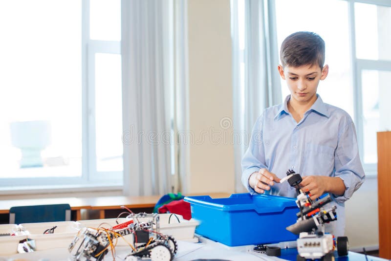 Little Boy in Robotics School Makes Robot Stock Photo - Image of child ...