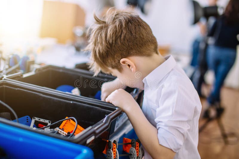 Little Boy in Robotics School Makes Robot Stock Photo - Image of hold ... Little Boy in Robotics School Makes Robot Stock Photo - Image of hold ...
