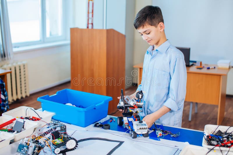 Little Boy in Robotics School Makes Robot Stock Image - Image of idea ... Little Boy in Robotics School Makes Robot Stock Image - Image of idea ...