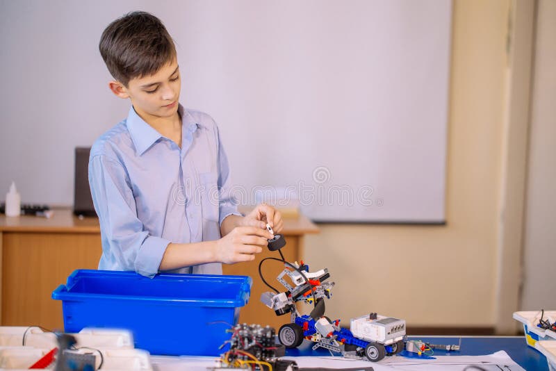 Little Boy in Robotics School Makes Robot Stock Photo - Image of ... Little Boy in Robotics School Makes Robot Stock Photo - Image of ...