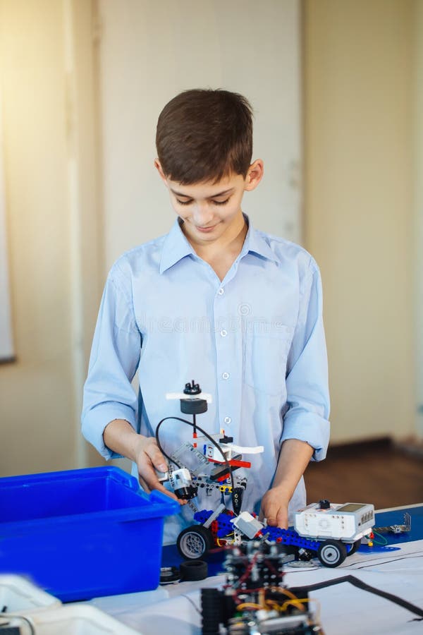 Little Boy in Robotics School Makes Robot Stock Photo - Image of hold ... Little Boy in Robotics School Makes Robot Stock Photo - Image of hold ...