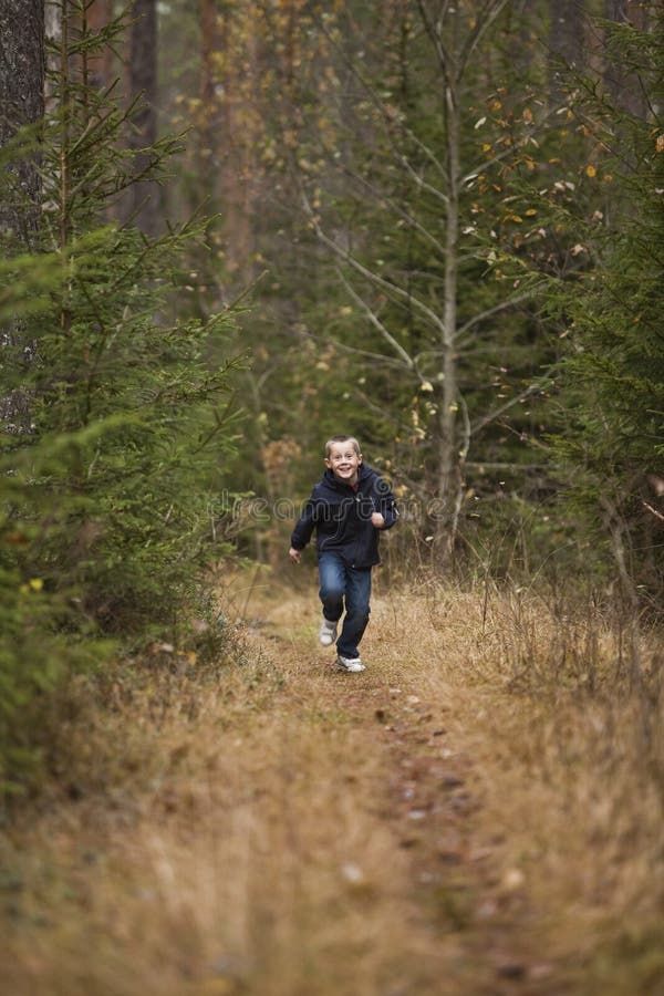 Little Boy Running stock image. Image of blurred, leisure - 16811327
