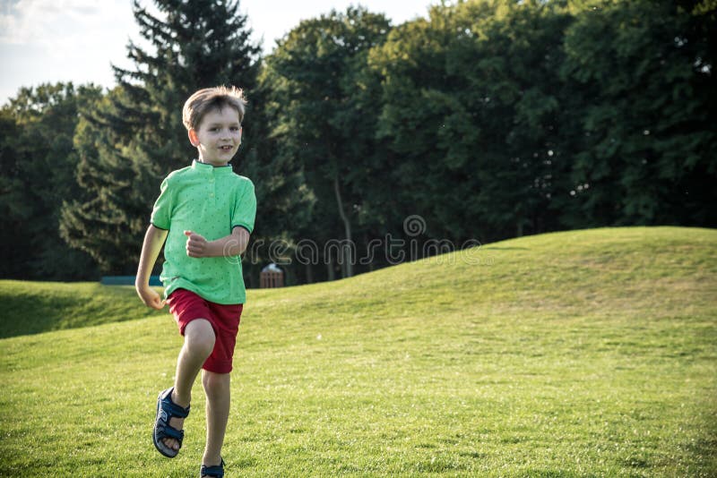Little Boy Running on the Grass on Huge Golf Field Stock Photo - Image ...