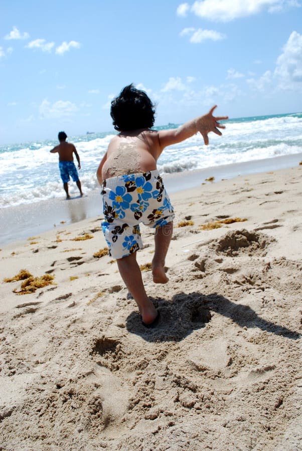 Boy running to the sea stock photo. Image of horizon - 19392034