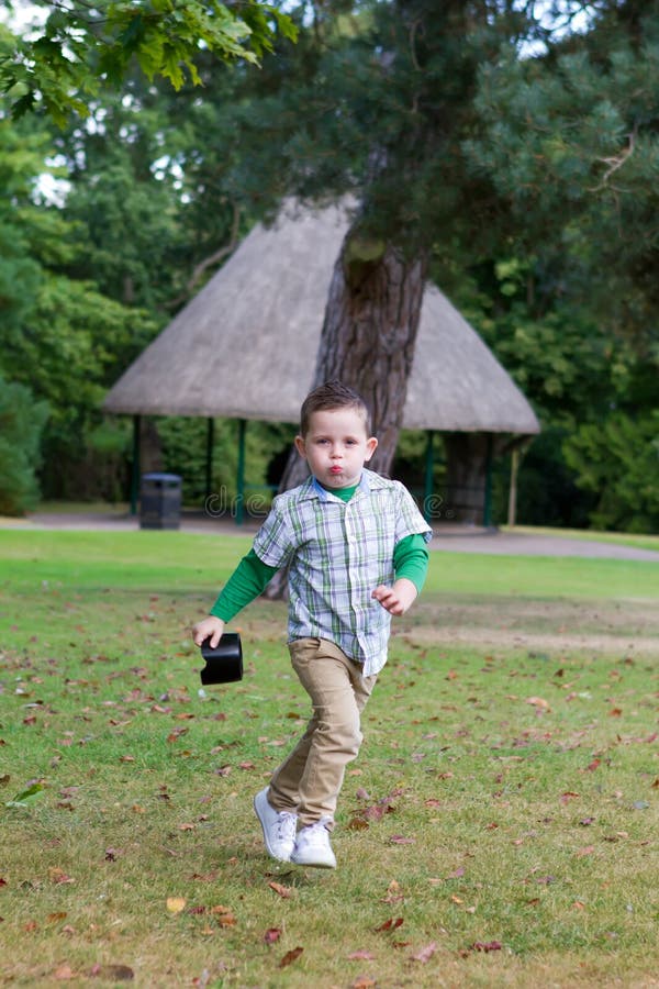 Little Boy Running the Park Stock Photo - Image of cheerful, caucasian ...