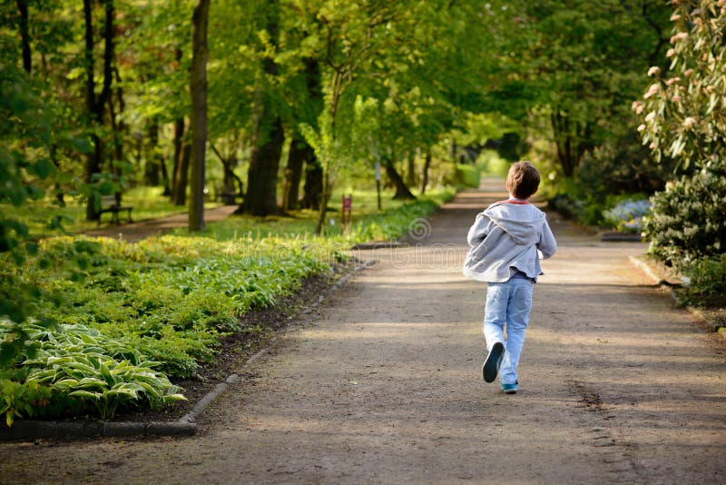 Little Boy Running in the Park. Back View Stock Image - Image of ...